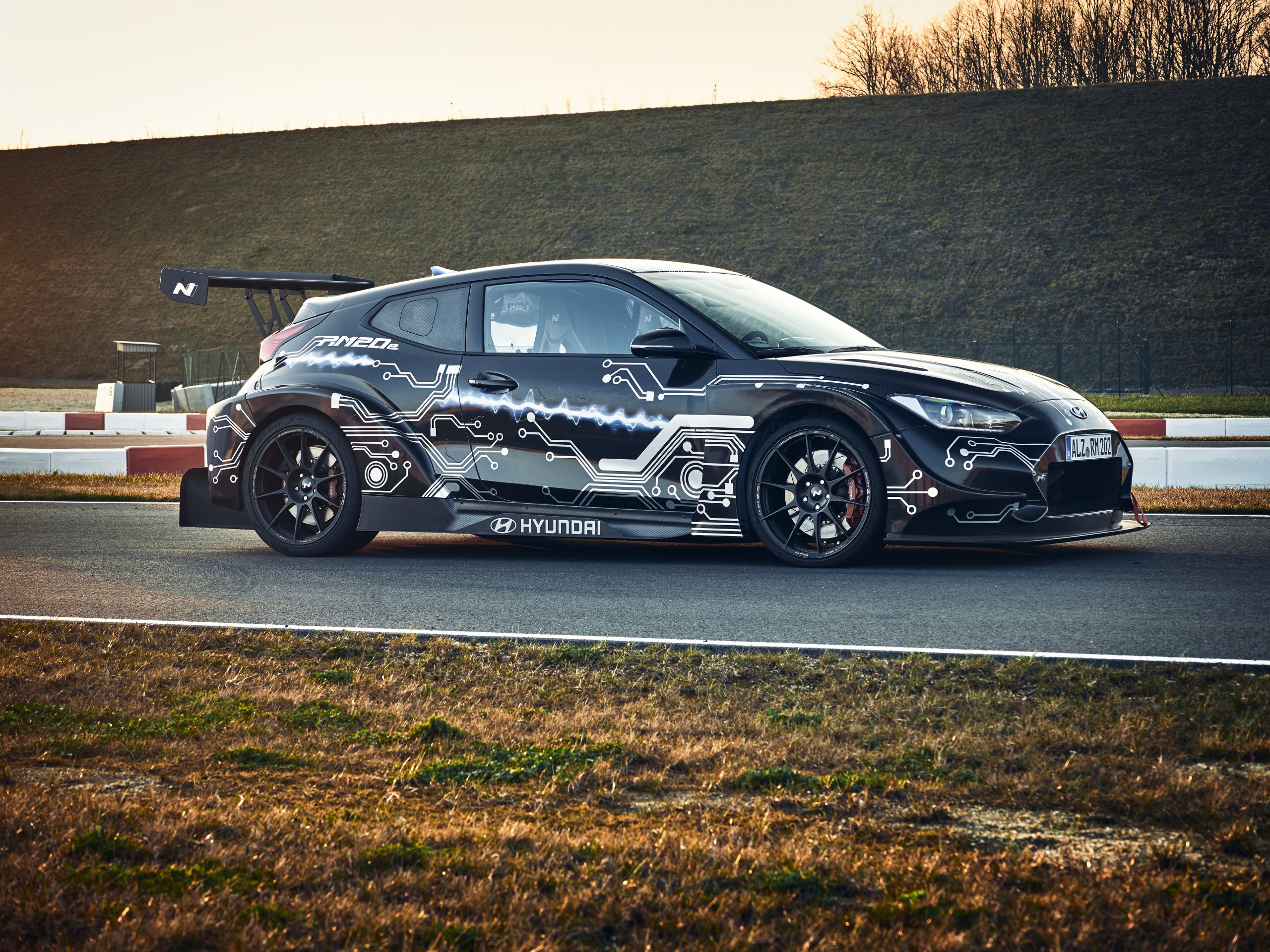 Watch a mid-engined Hyundai hatch tear up the track with Rimac e-power ...