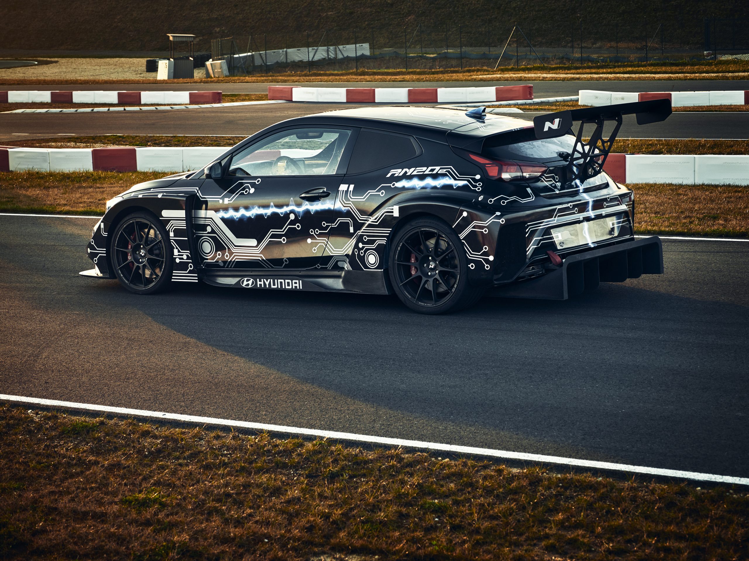 Watch a mid-engined Hyundai hatch tear up the track with Rimac e-power ...