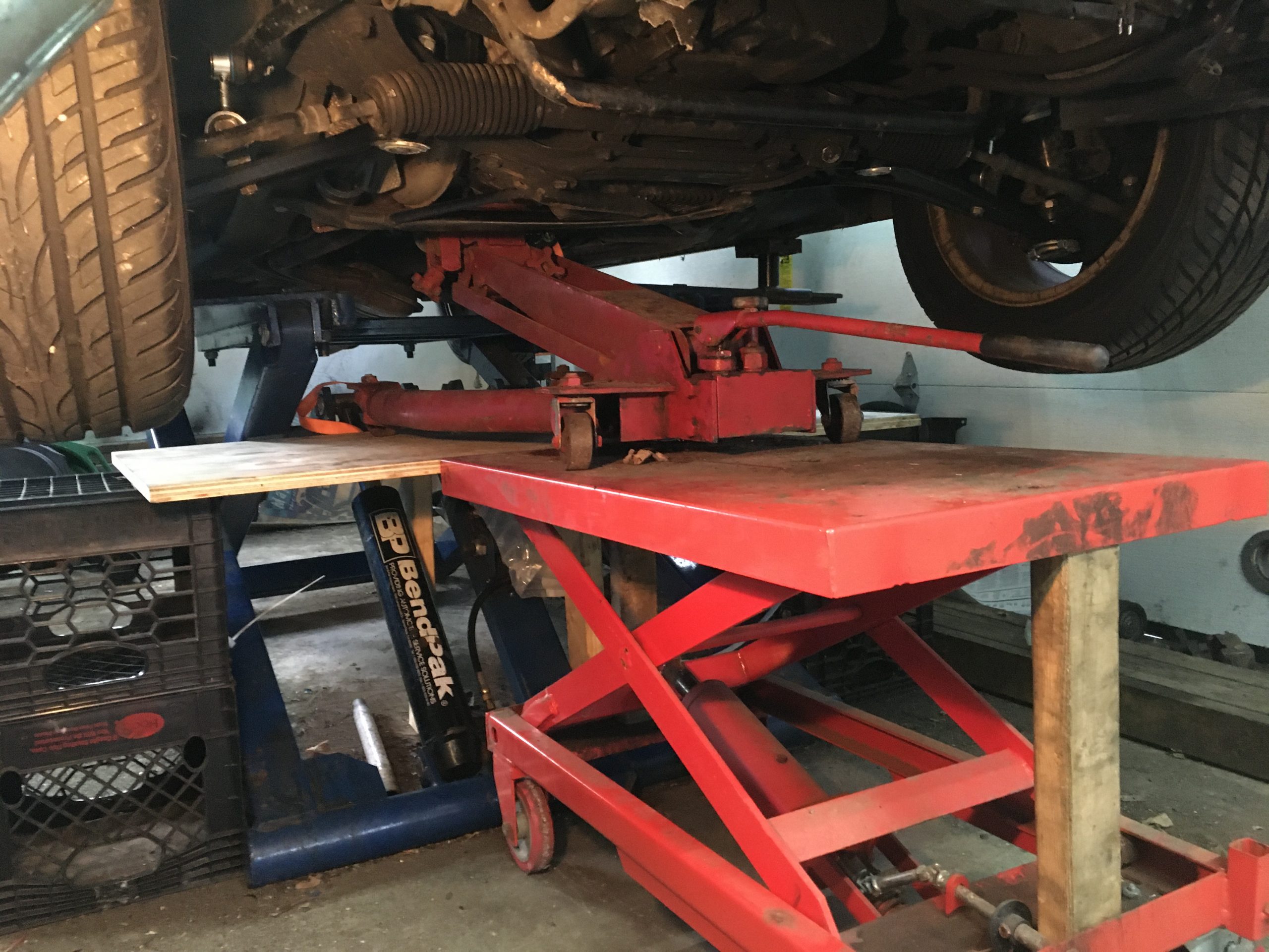 Removing a transmission on a mid-rise lift - Hagerty Media