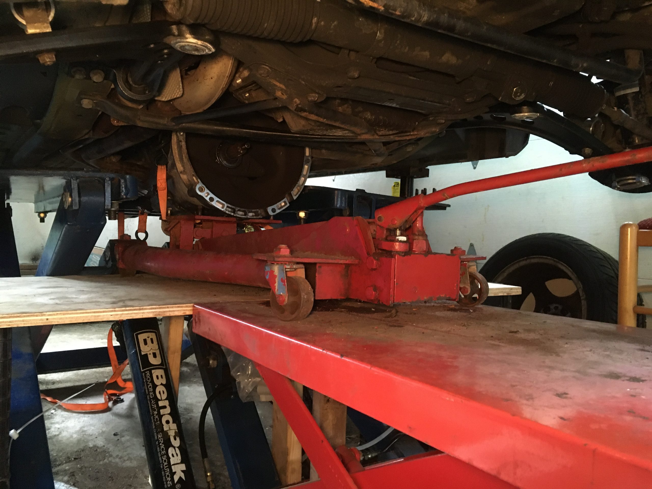 Removing a transmission on a mid-rise lift - Hagerty Media