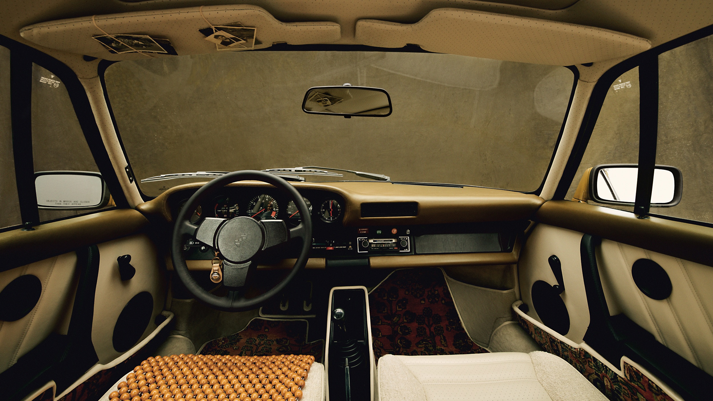 This couture Porsche 911 has Persian carpets and a bead mat seat ...
