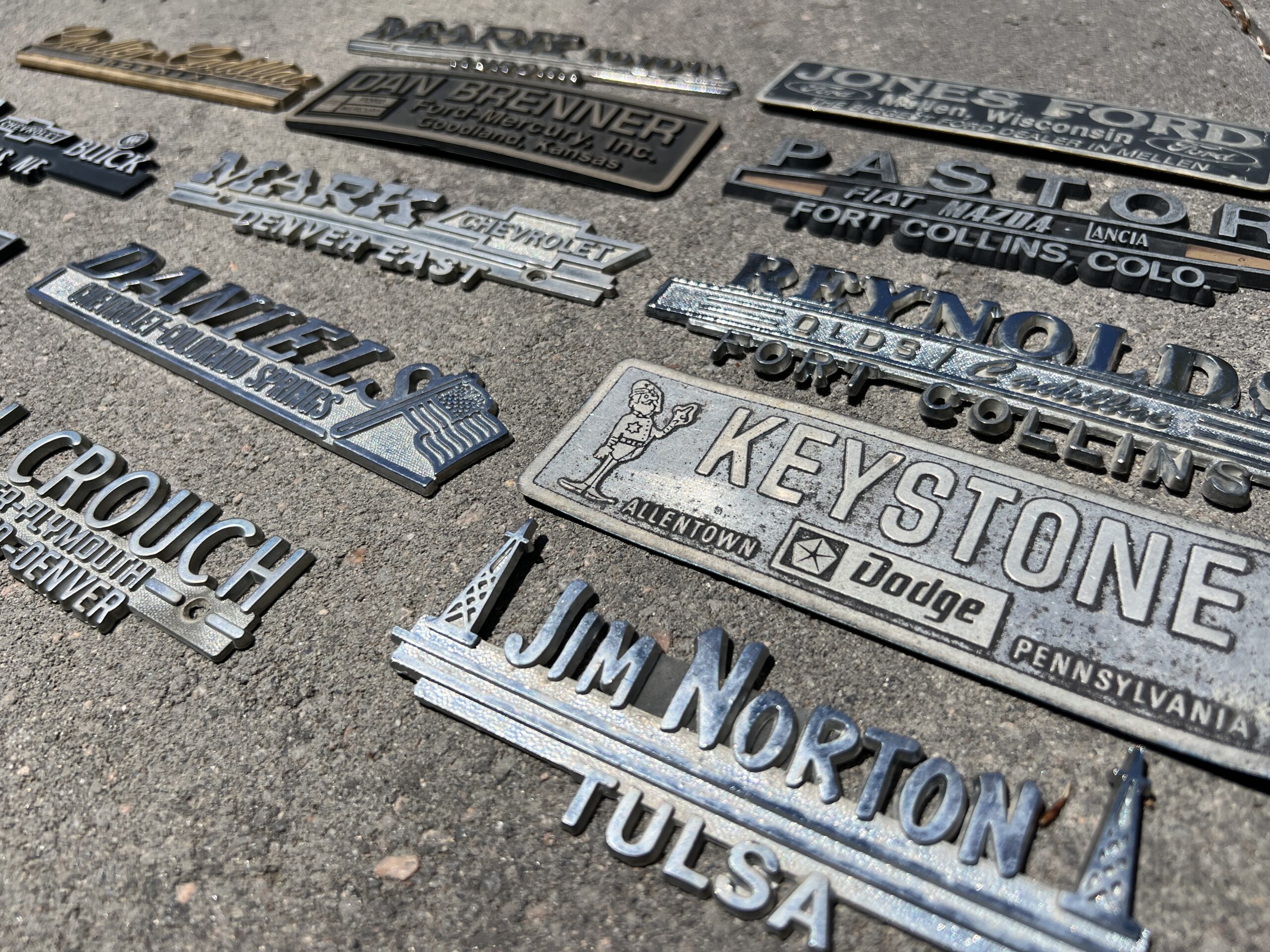Vintage Dealership Badges and License Plate Frames Are the Ultimate ...